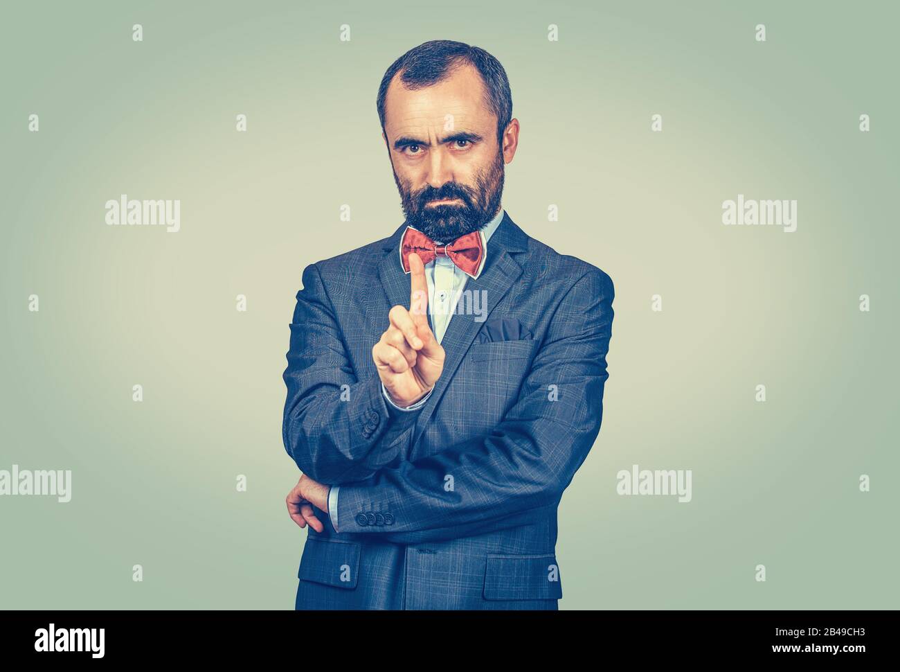 unhappy, serious man gesturing a no sign. Guy raising finger up saying ... unhappy, serious man gesturing a no sign. Guy raising finger up saying ...