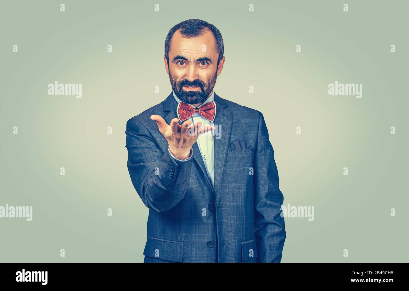 Angry young Italian businessman hand in air in frustration looking at ...