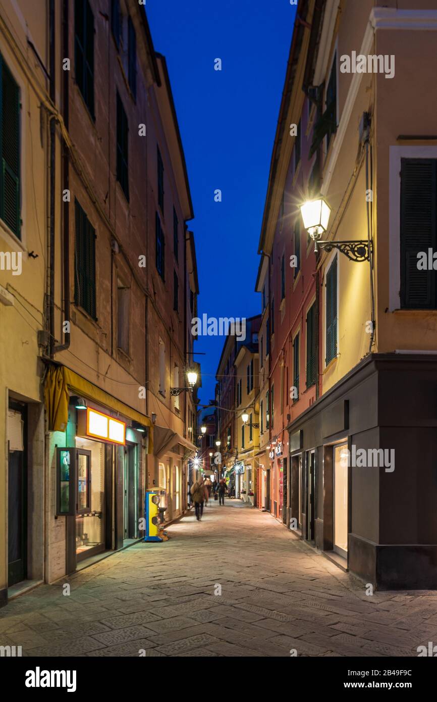 View along typical Italian narrow street in Alassio old town, Liguria ...