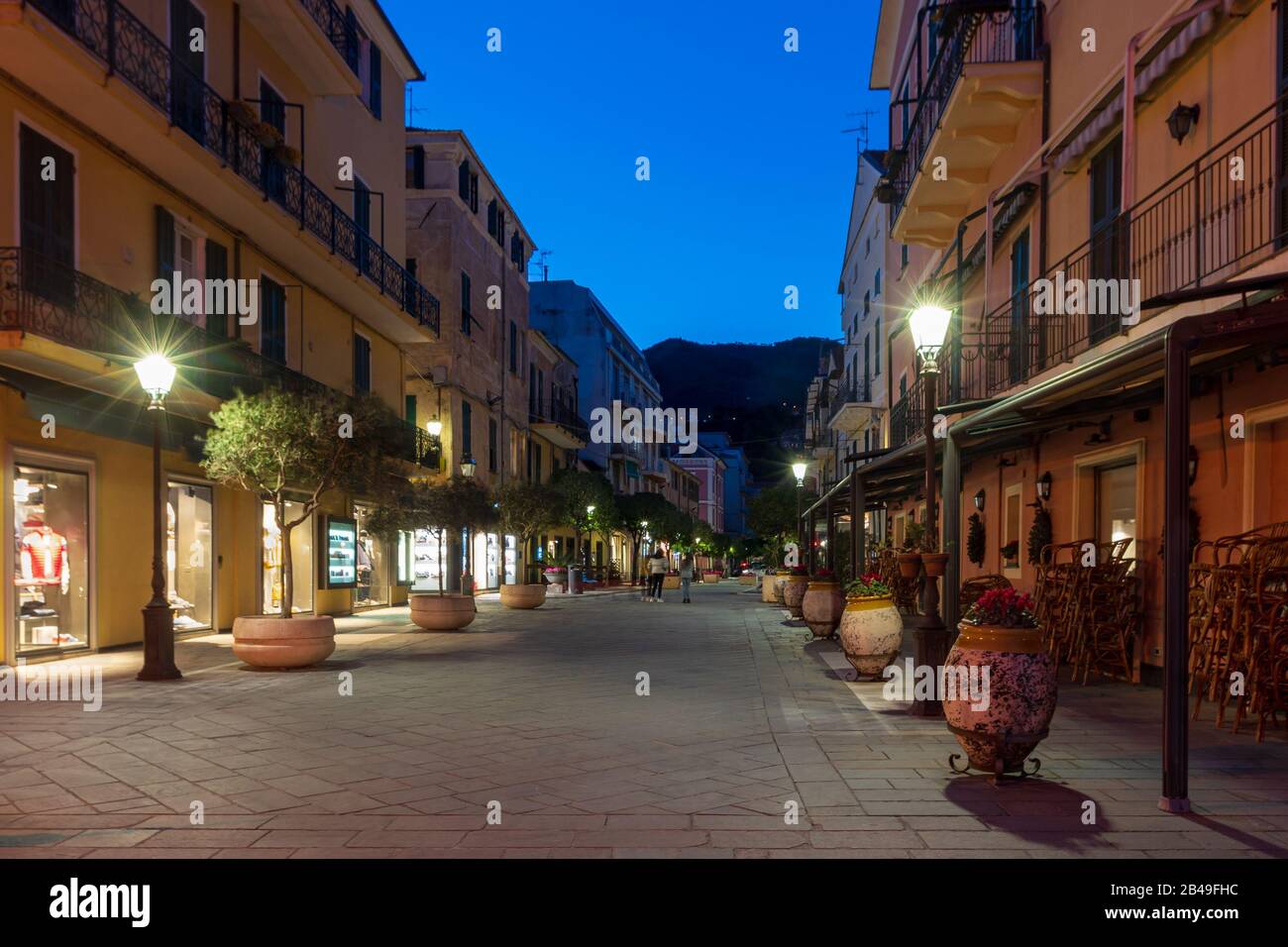 View along typical Italian narrow street in Alassio old town, Liguria ...
