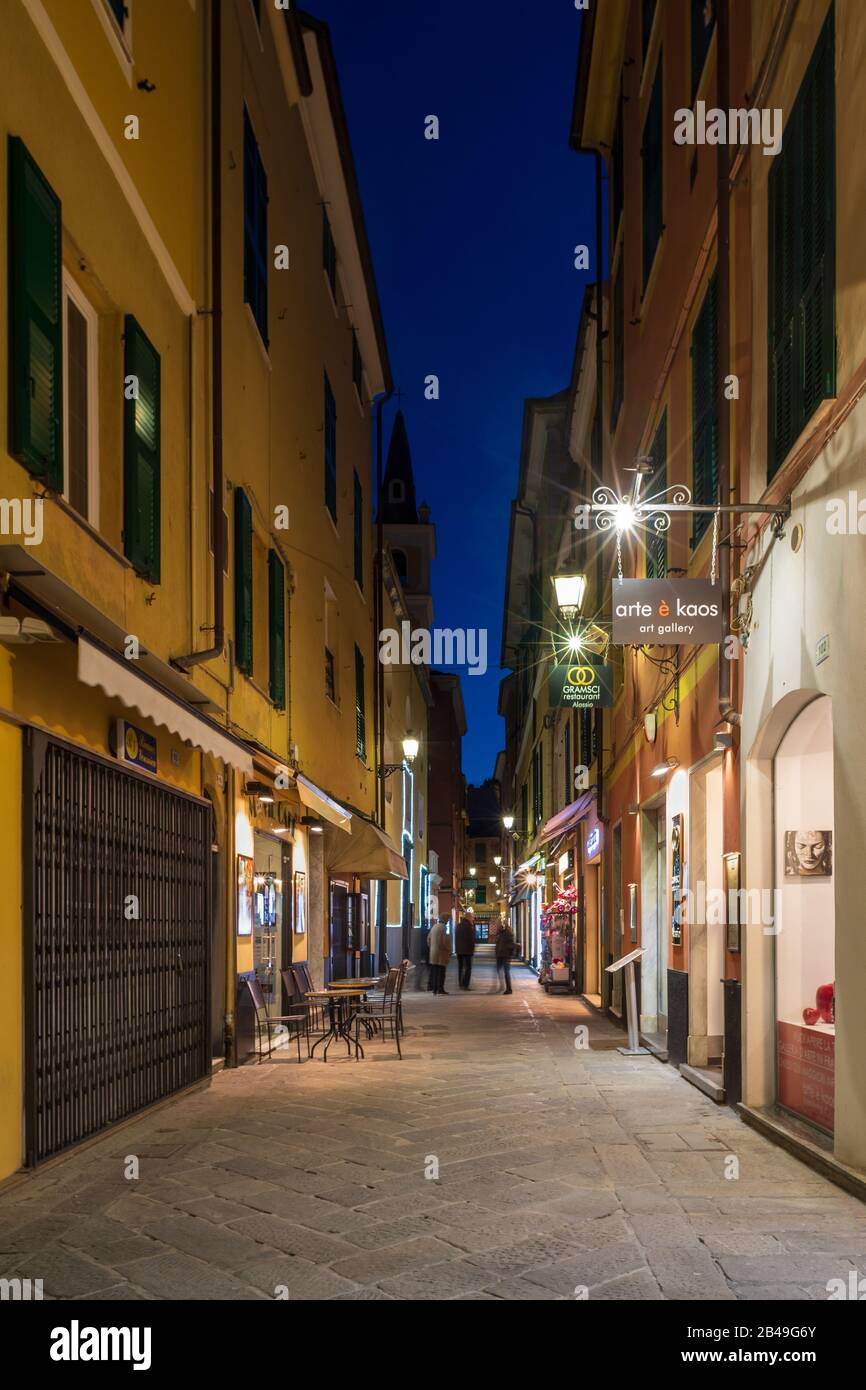 View along typical Italian narrow street in Alassio old town, Liguria ...