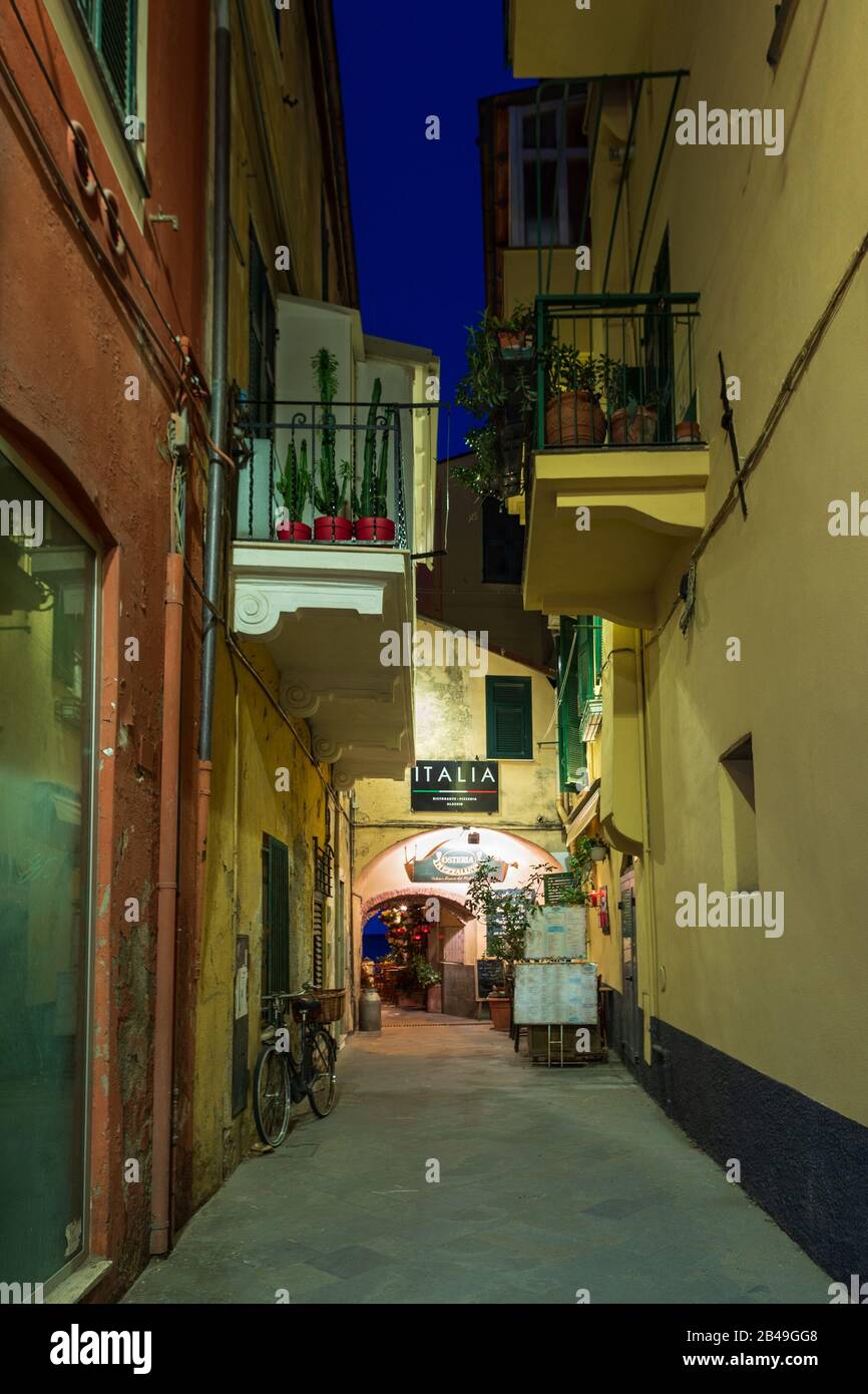 View along typical Italian narrow street in Alassio old town, Liguria ...