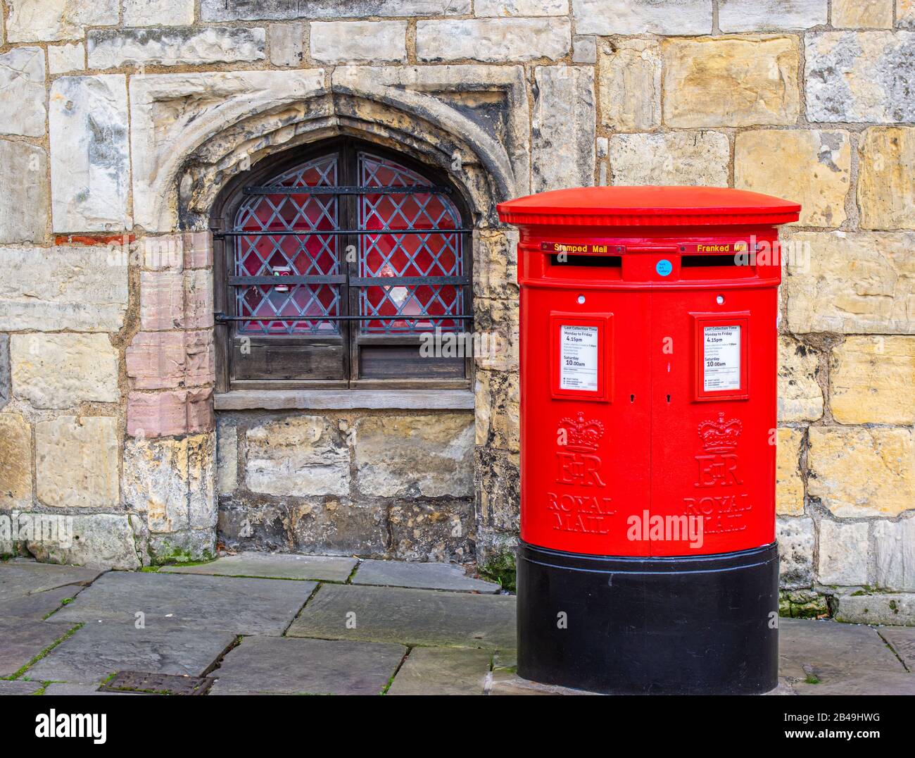 Red british post box in a city street hi-res stock photography and ...