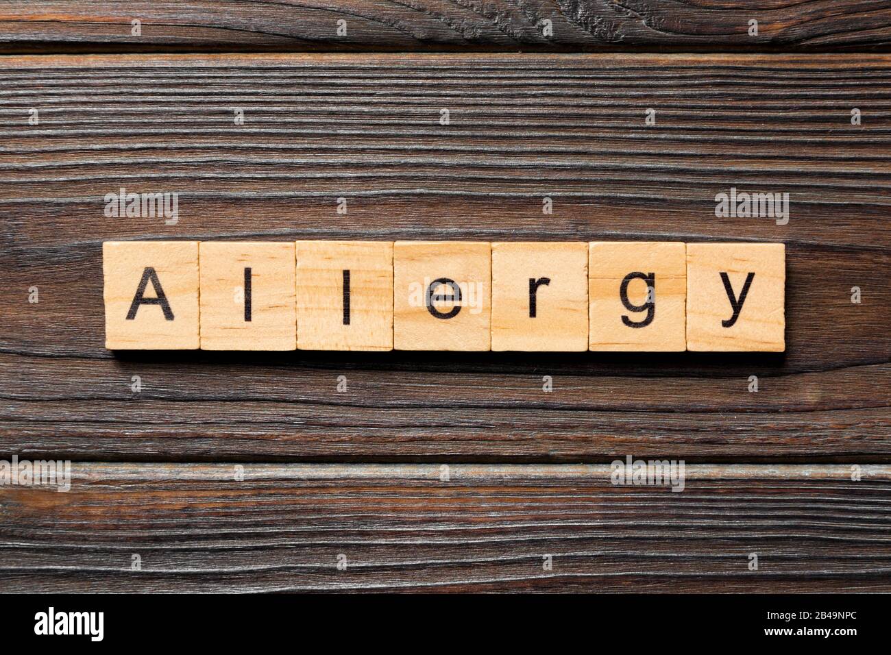 Allergy word written on wood block. Allergy text on wooden table for ...
