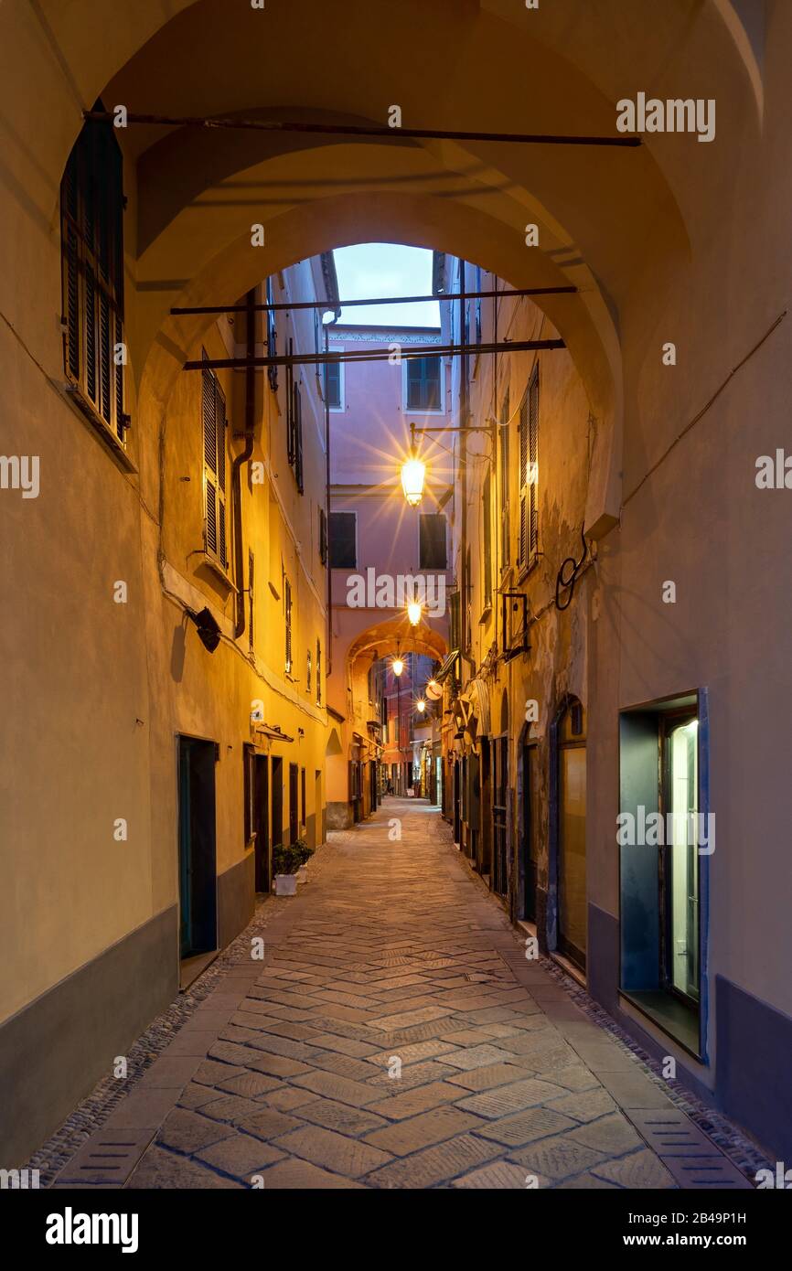 View along typical Italian narrow street in Laigueglia old town, famous ...