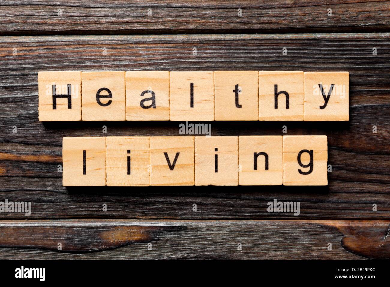 Healthy Living word written on wood block. Healthy Living text on ...