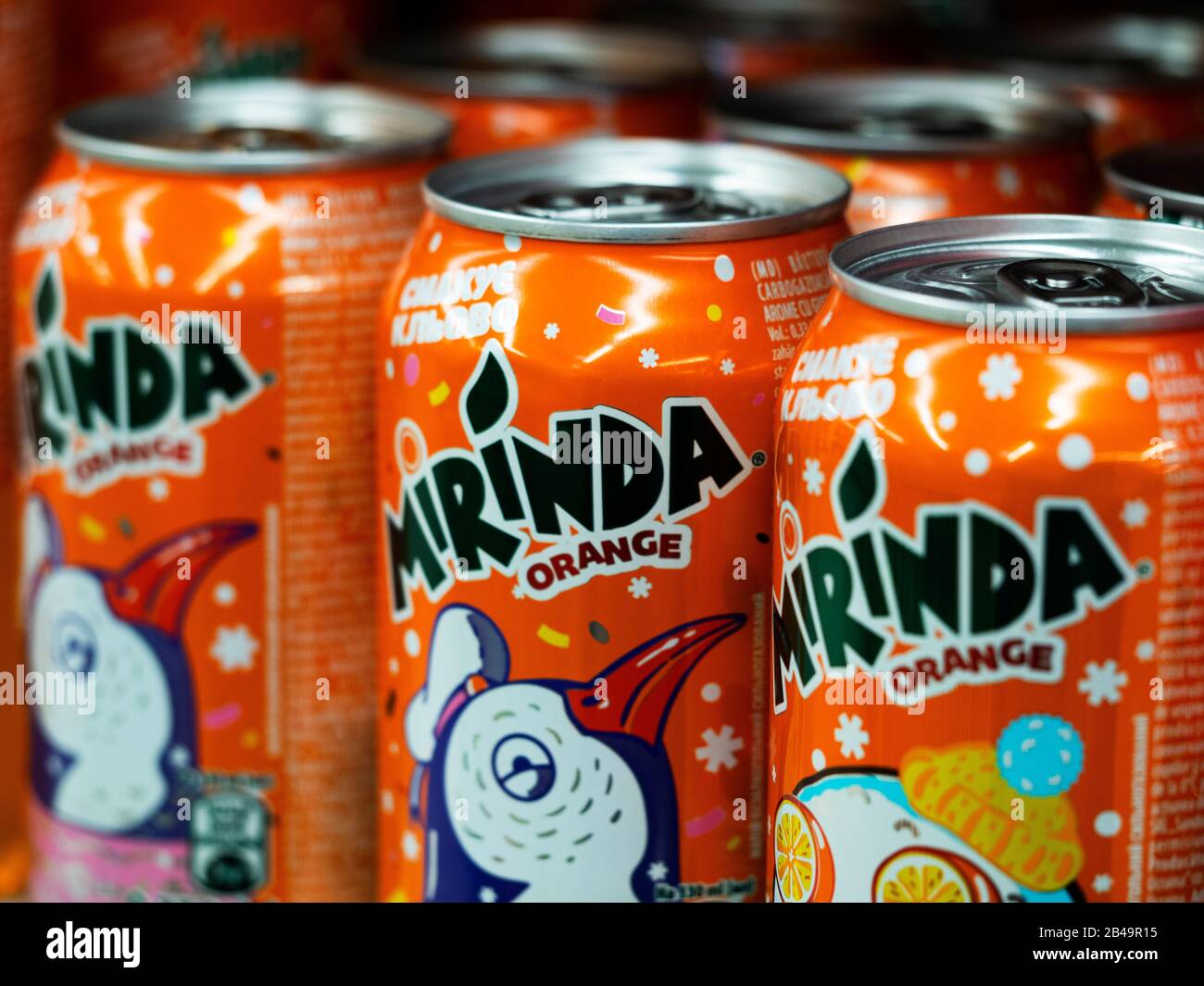 Cans of Mirinda Orange on a shelf in a store Stock Photo - Alamy