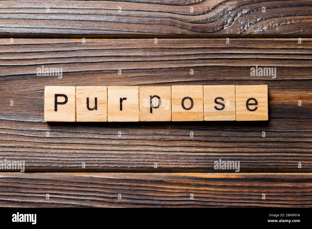 purpose word written on wood block. purpose text on table, concept ...