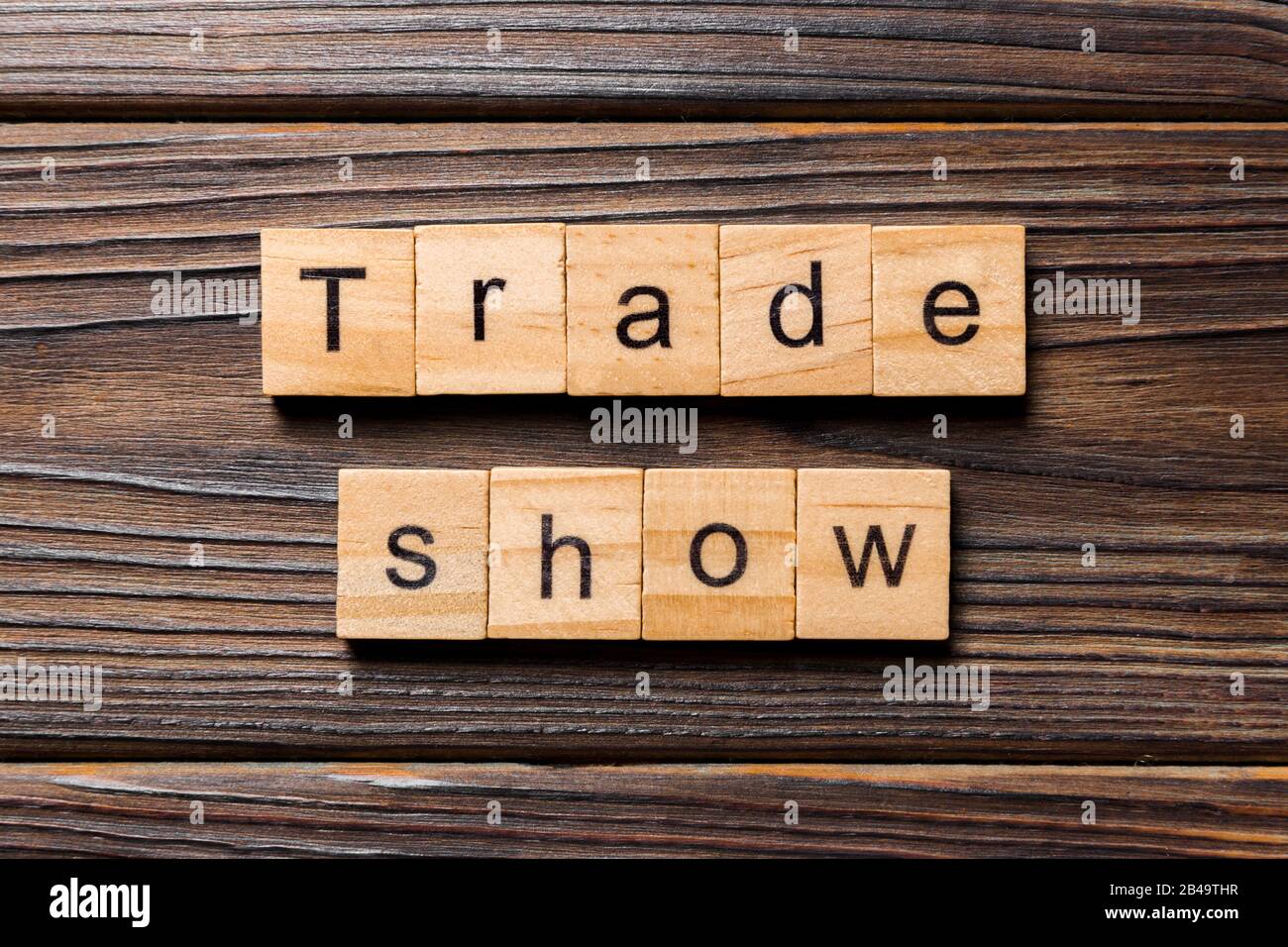 Trade Show word written on wood block. Trade Show text on wooden table ...
