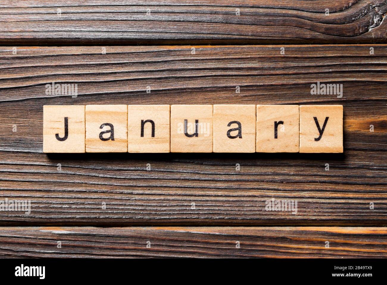 January word written on wood block. January text on wooden table for ...