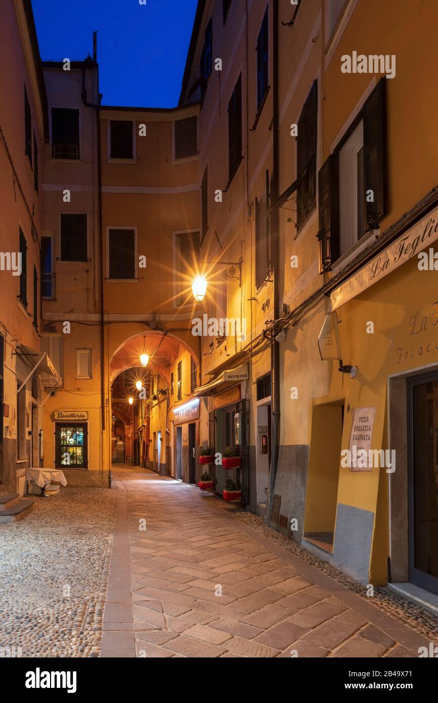 View along typical Italian narrow street in Laigueglia old town, famous ...