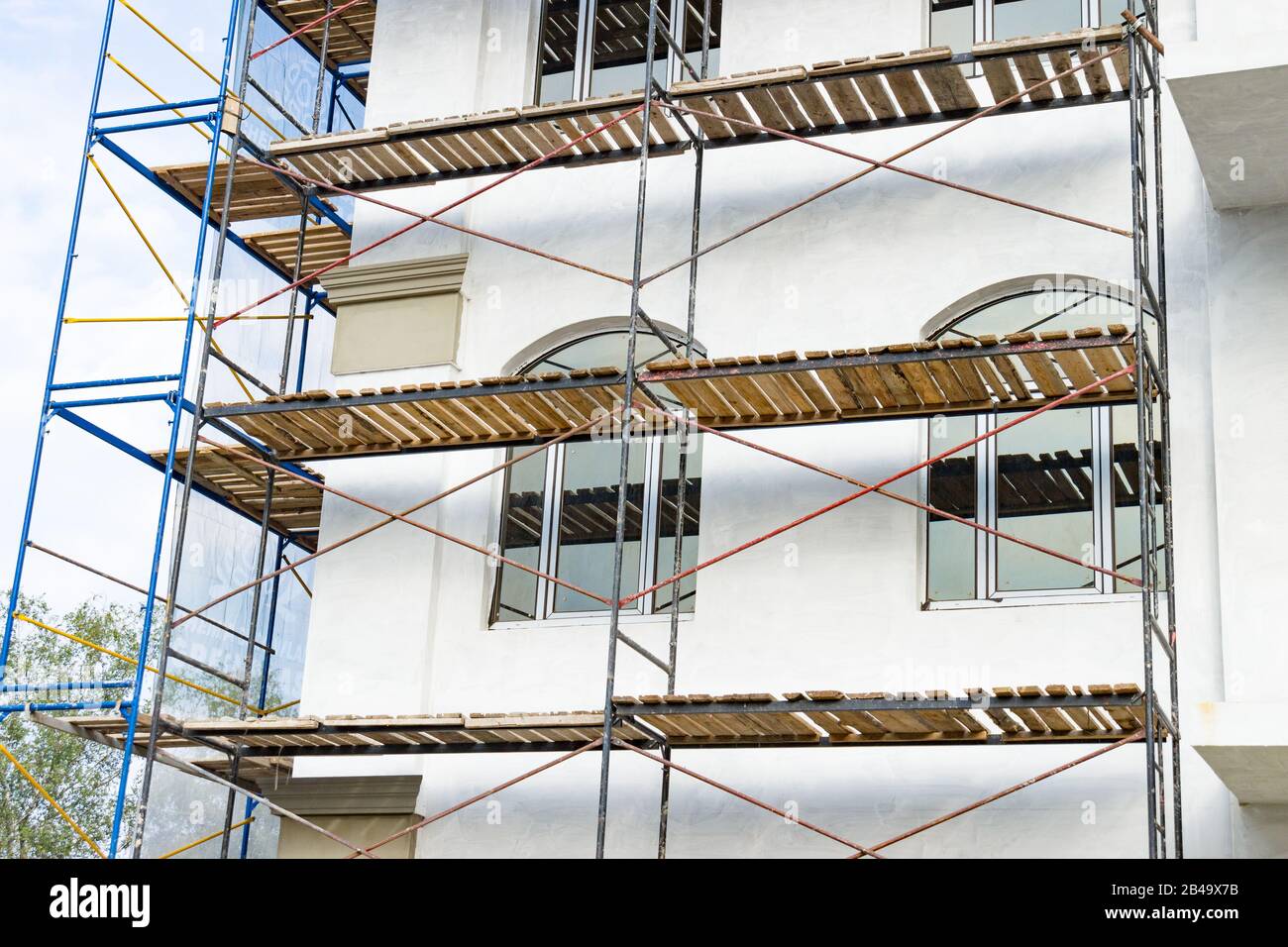 Extensive scaffolding for building a new house. Constraction of ...