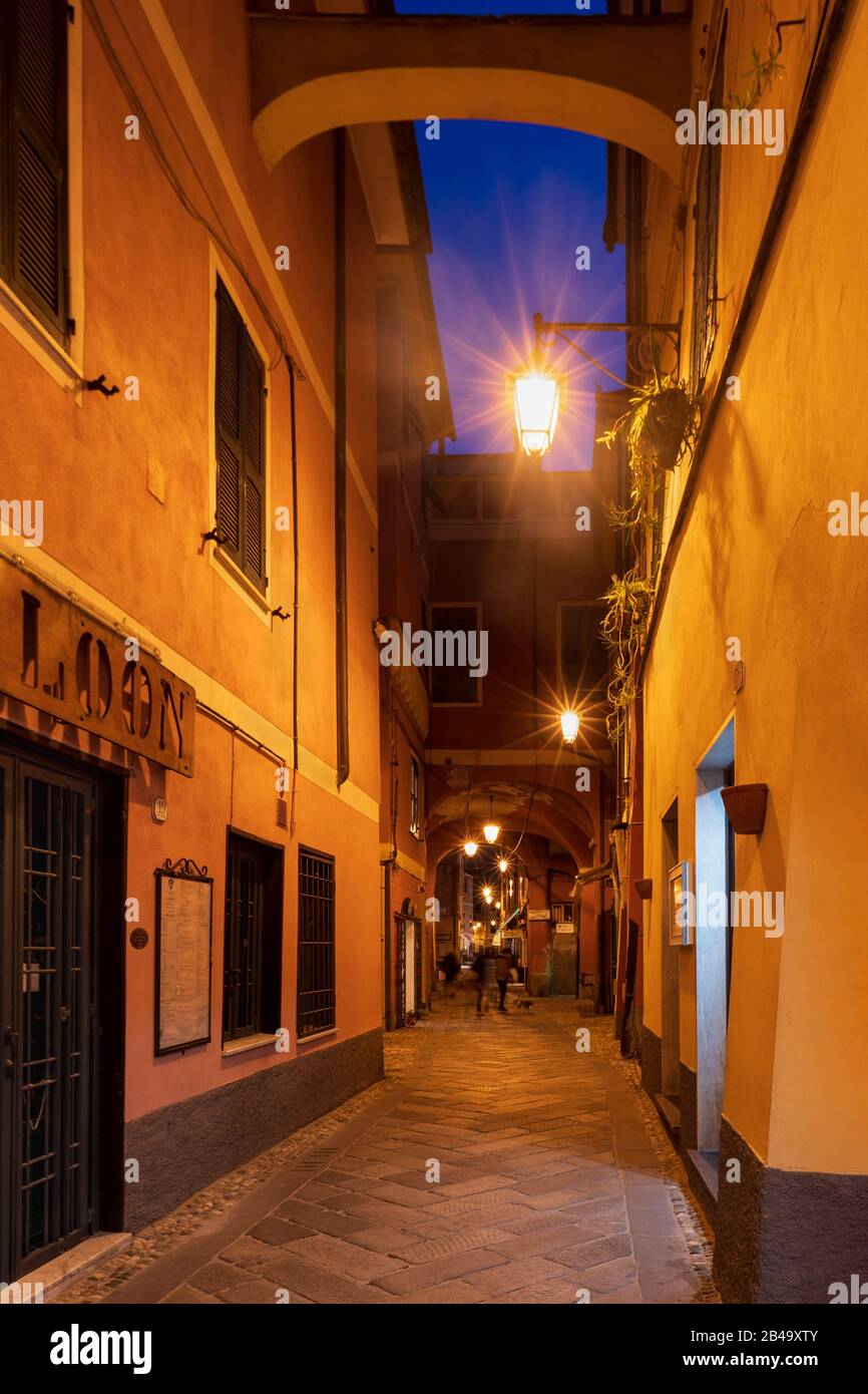 View along typical Italian narrow street in Laigueglia old town, famous ...