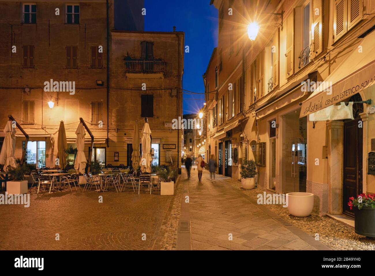View along typical Italian narrow street in Laigueglia old town, famous ...
