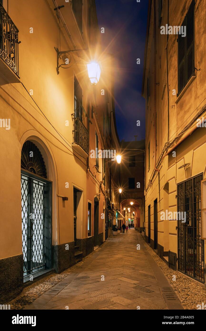 View along typical Italian narrow street in Laigueglia old town, famous ...