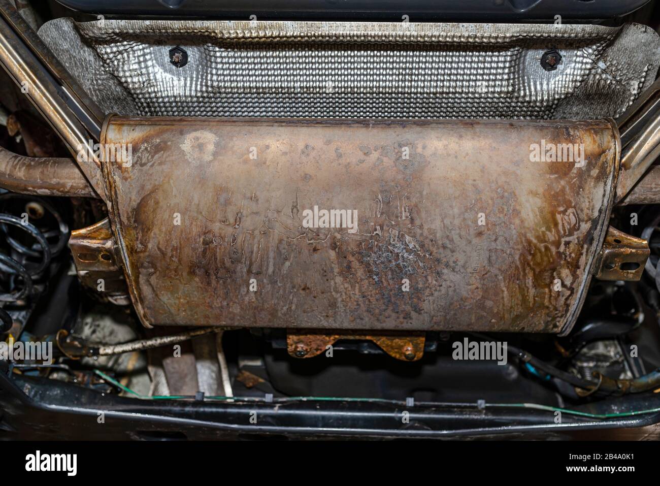 The exhaust system in the car seen from below, the car is on the lift ...
