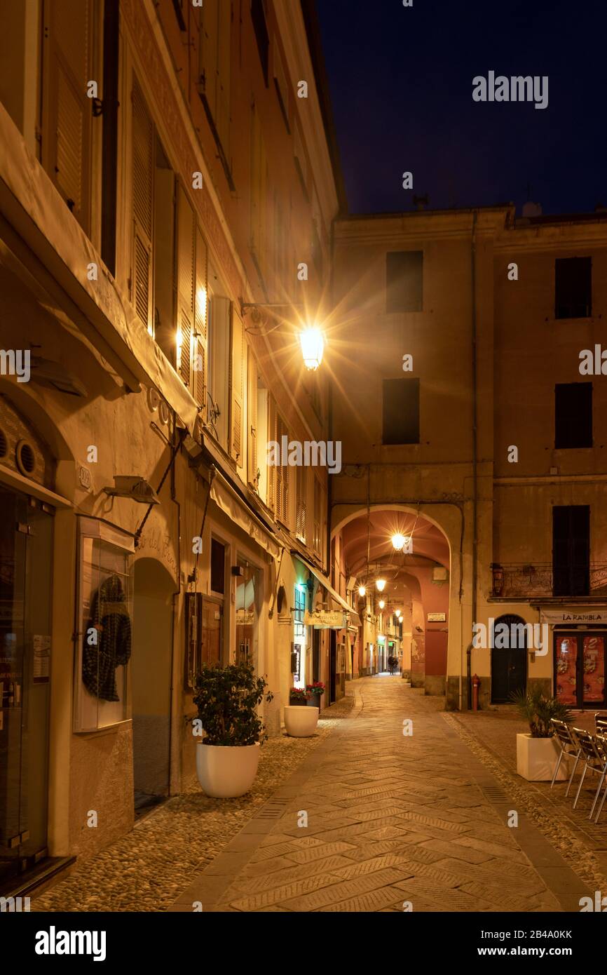 View along typical Italian narrow street in Laigueglia old town, famous ...