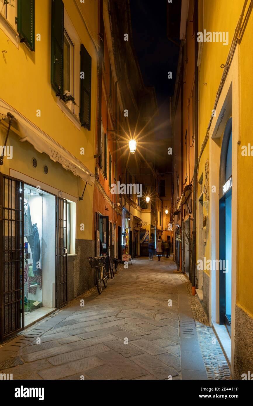 View along typical Italian narrow street in Laigueglia old town, famous ...