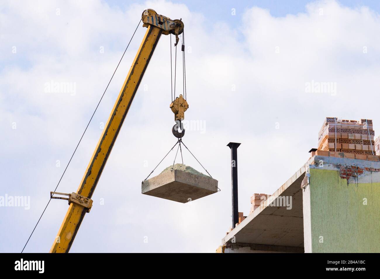 Industrial background made of crane construction at the buildings ...