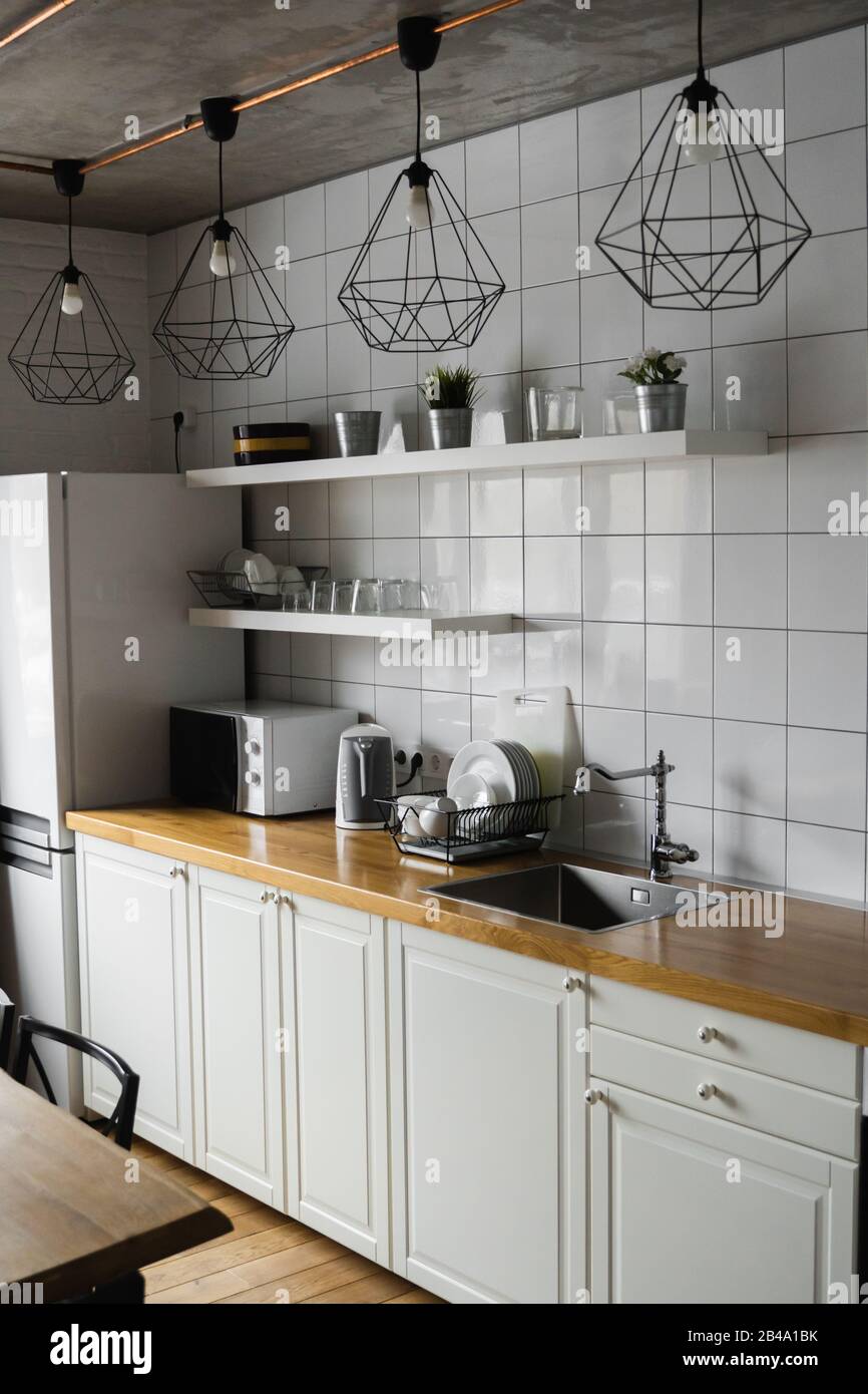 Modern, bright, clean, kitchen interior with stainless steel appliances ...