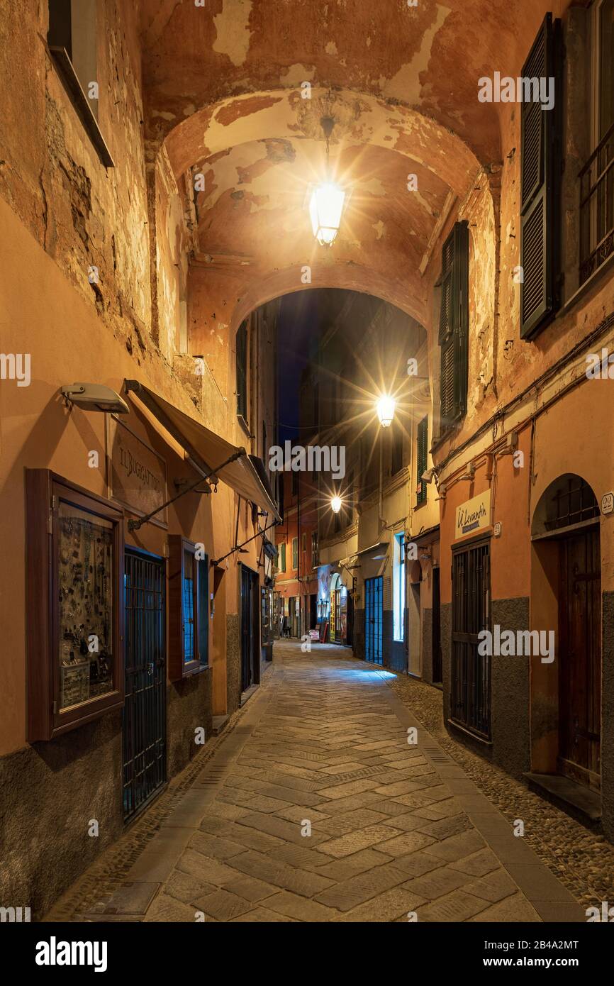 View along typical Italian narrow street in Laigueglia old town, famous ...