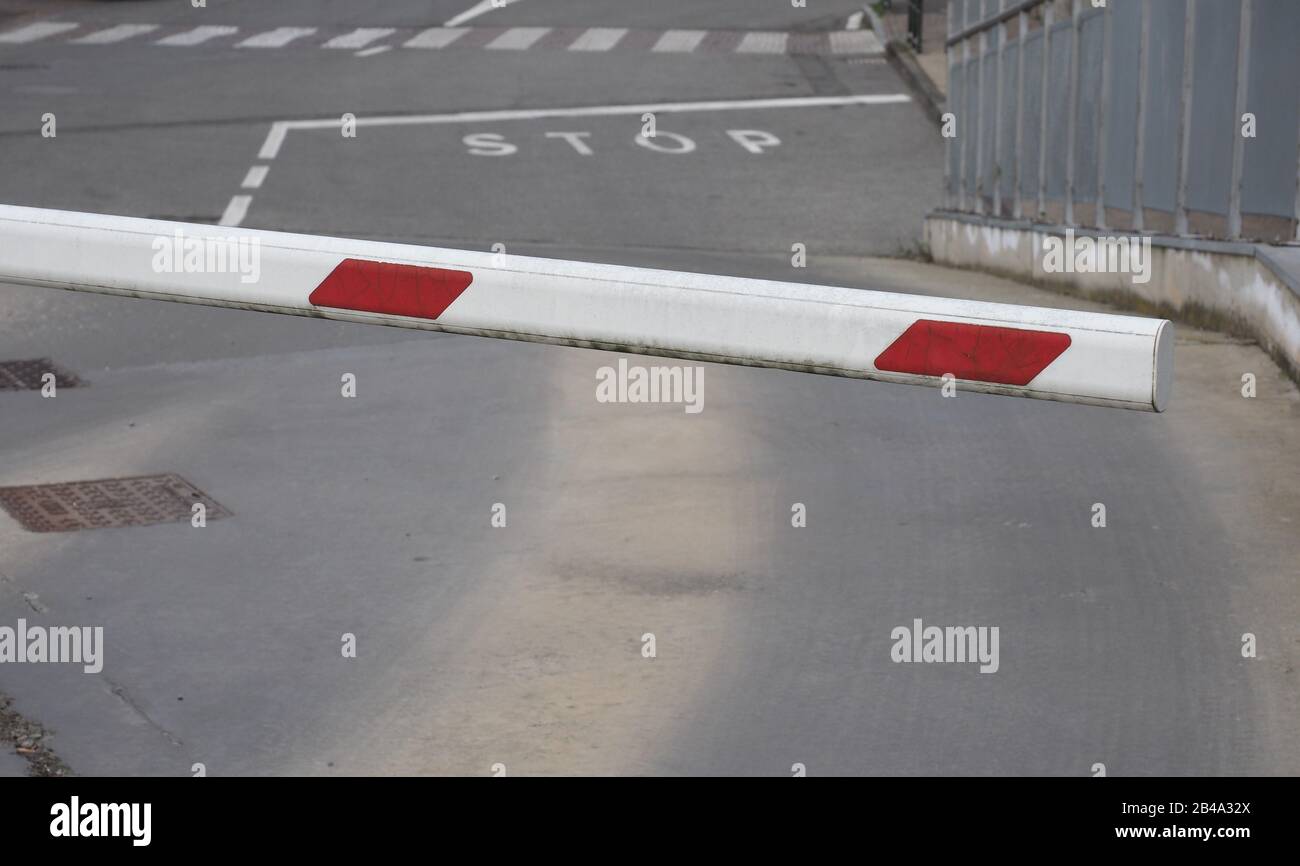 red and white car parking bar and stop sign Stock Photo - Alamy