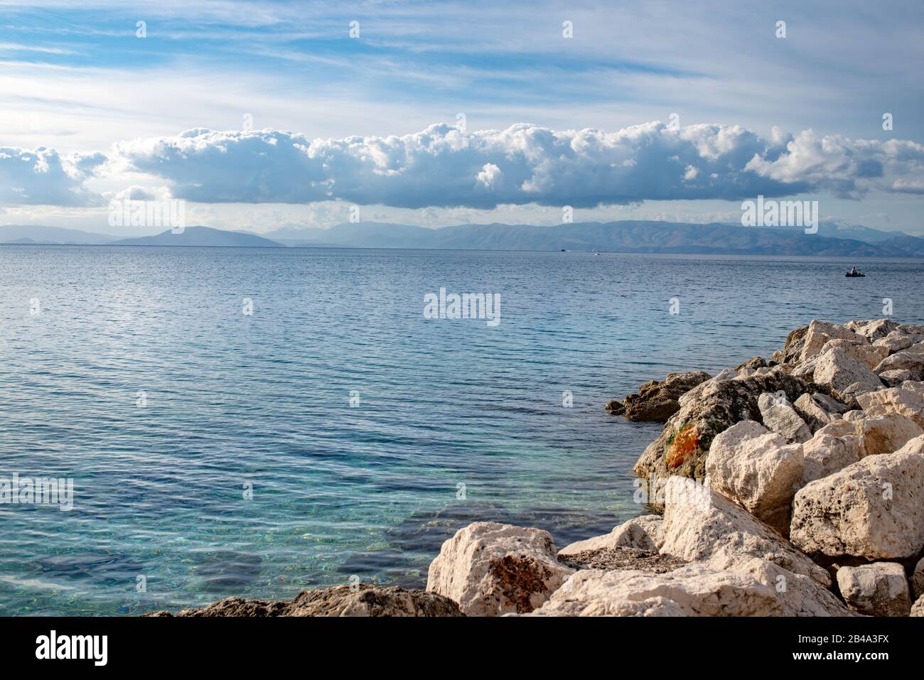 Amazing bay with crystal clear water and big stones on Corfu island ...