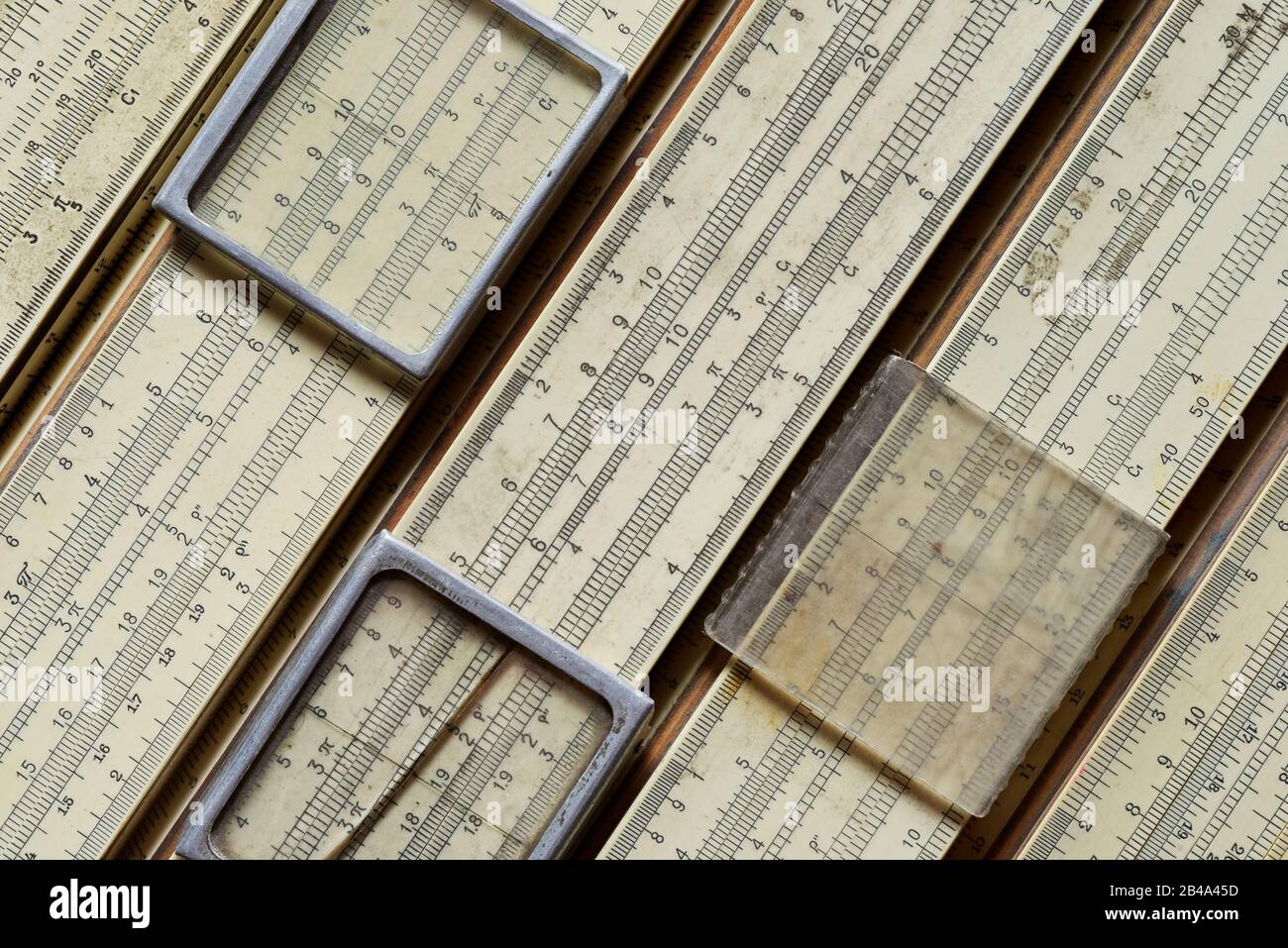 Backgrounds and textures: group of old slide rules, or slipsticks ...