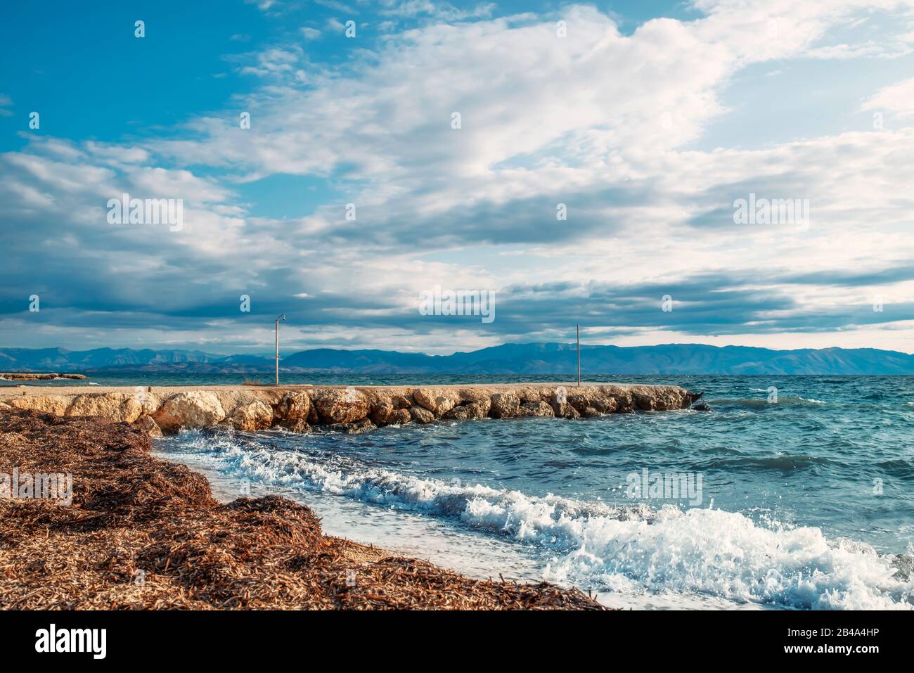 Amazing green sandy bay with crystal clear water, big stones on Corfu ...
