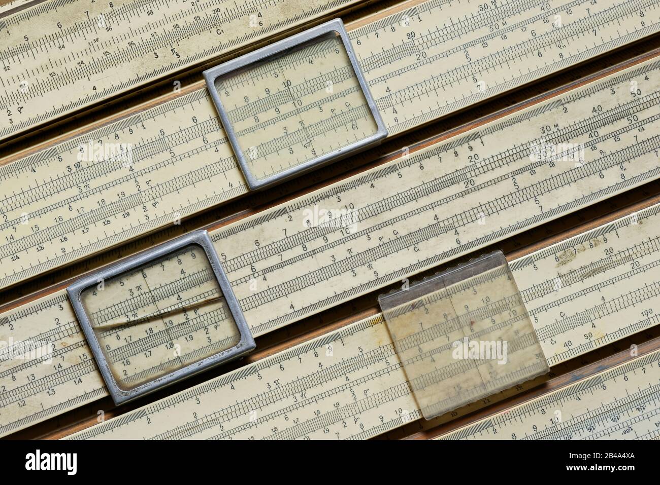 Backgrounds and textures: group of old slide rules, or slipsticks ...