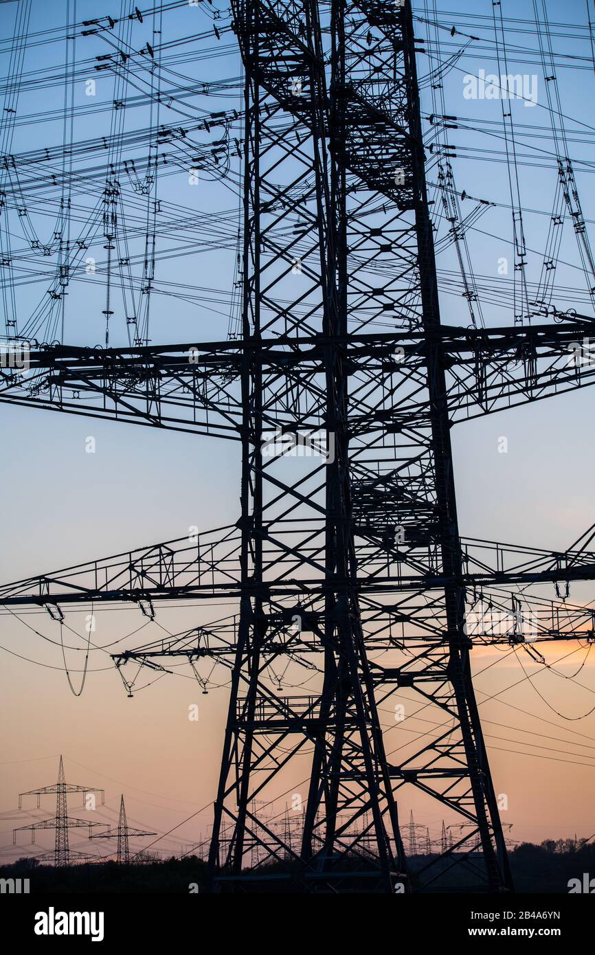 construction of electricity pylons with confusion of wiring in blue sky ...