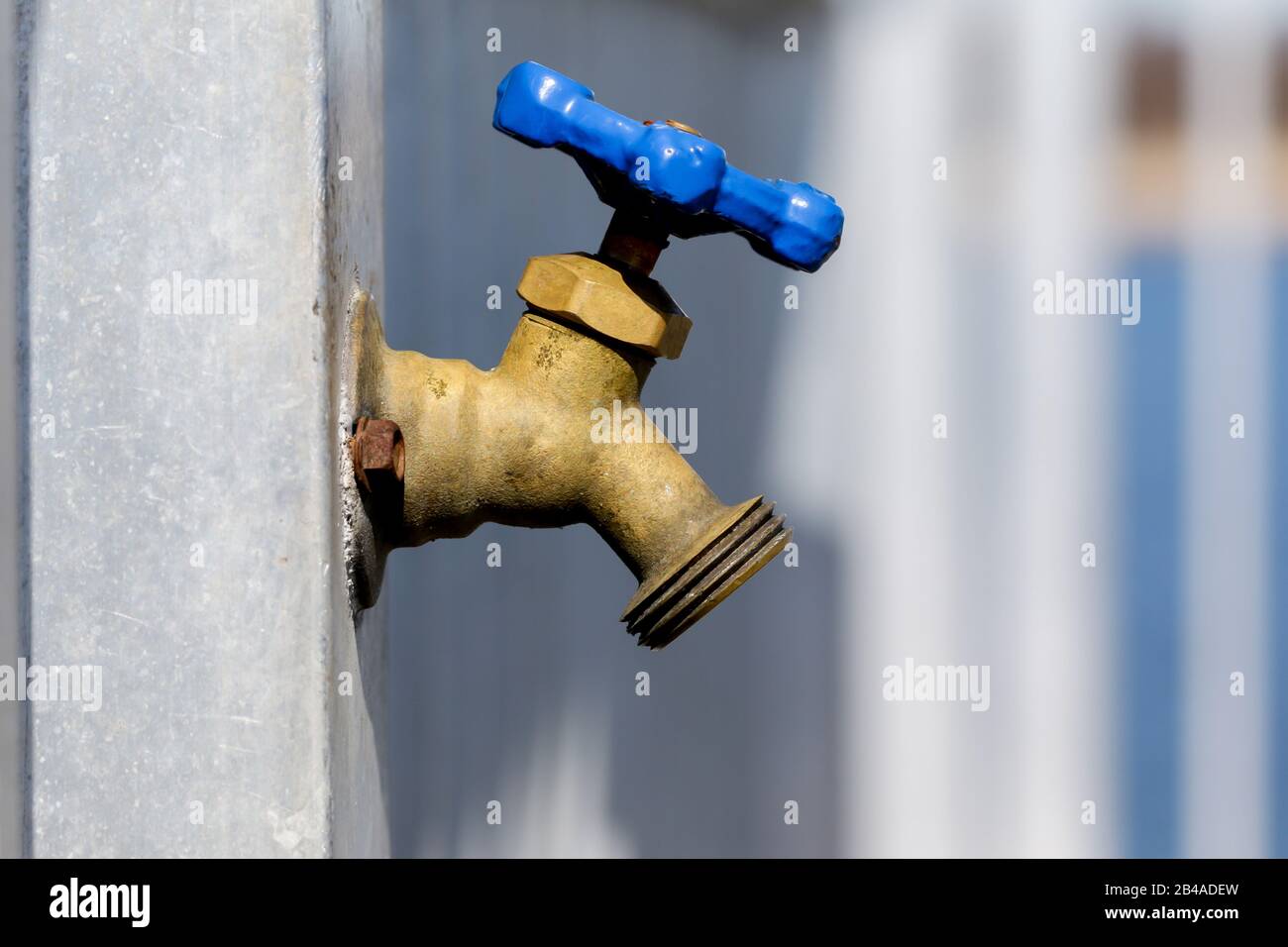Brass water end of line valve outside Stock Photo - Alamy