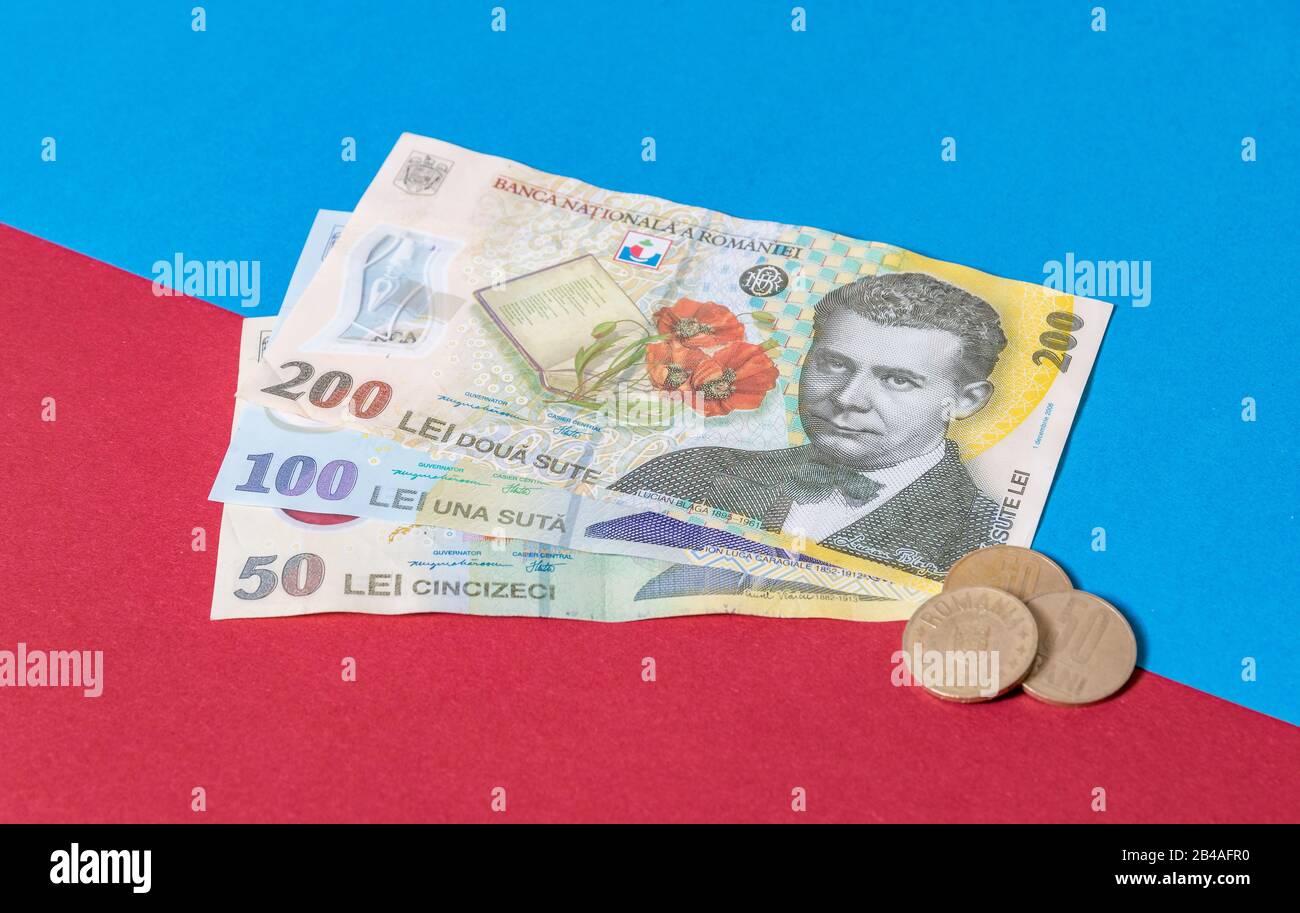 Romanian banknotes on a blue and red background. Coloseup of RON ...