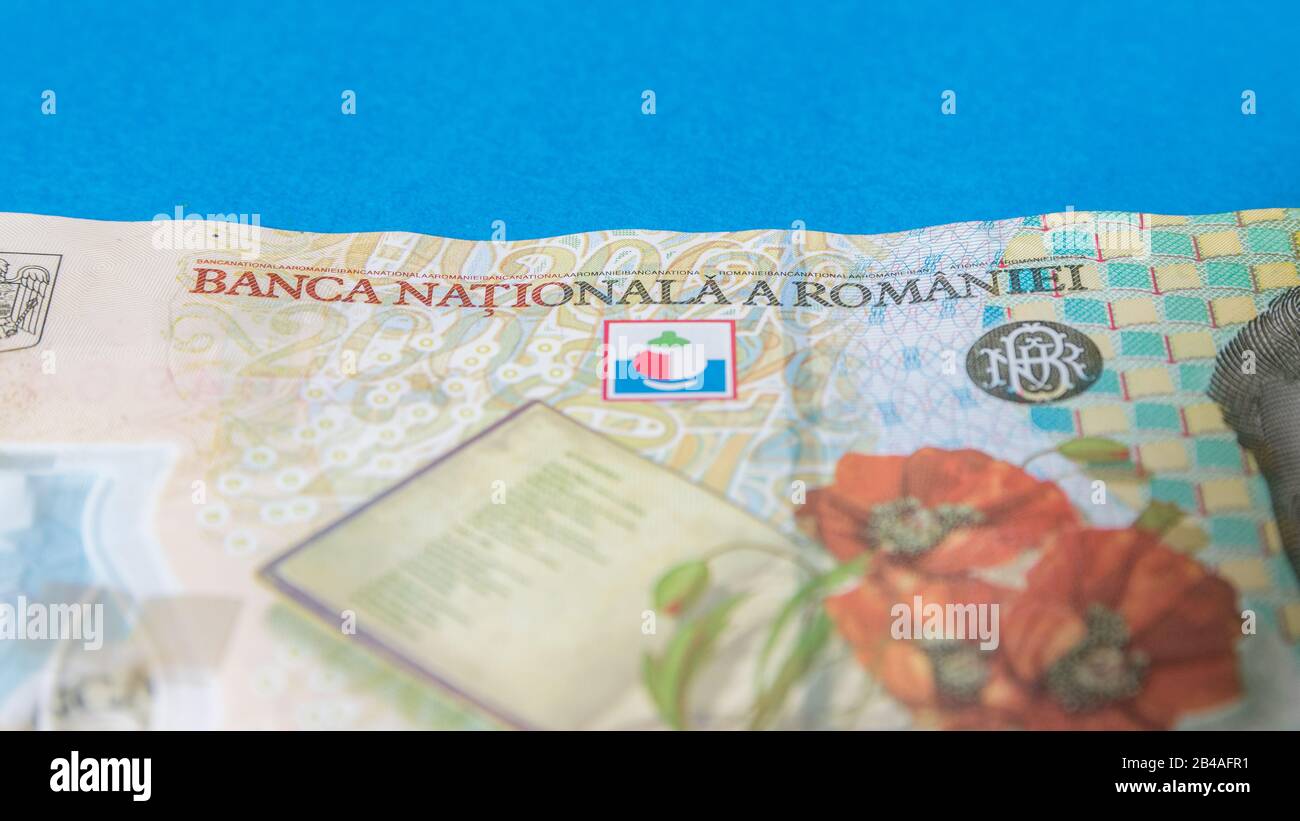 Romanian banknotes on a blue and red background. Coloseup of RON ...