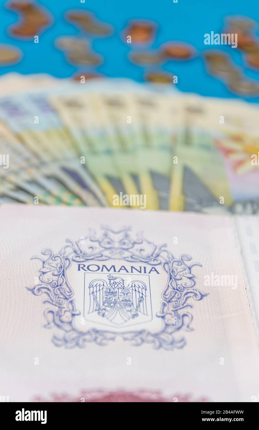 Romanian concept. The Romanian passport and Romanian banknotes/coins on ...