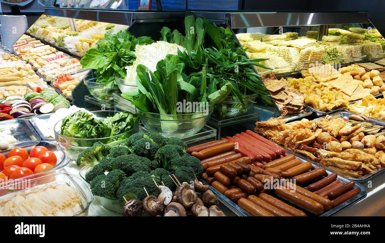 Showcases with a beautiful layout of Chinese food. Food court in the ...