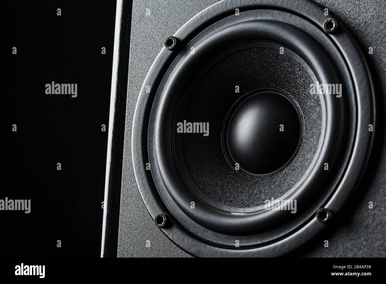 Multimedia speaker system speaker close-up on a black background. A ...