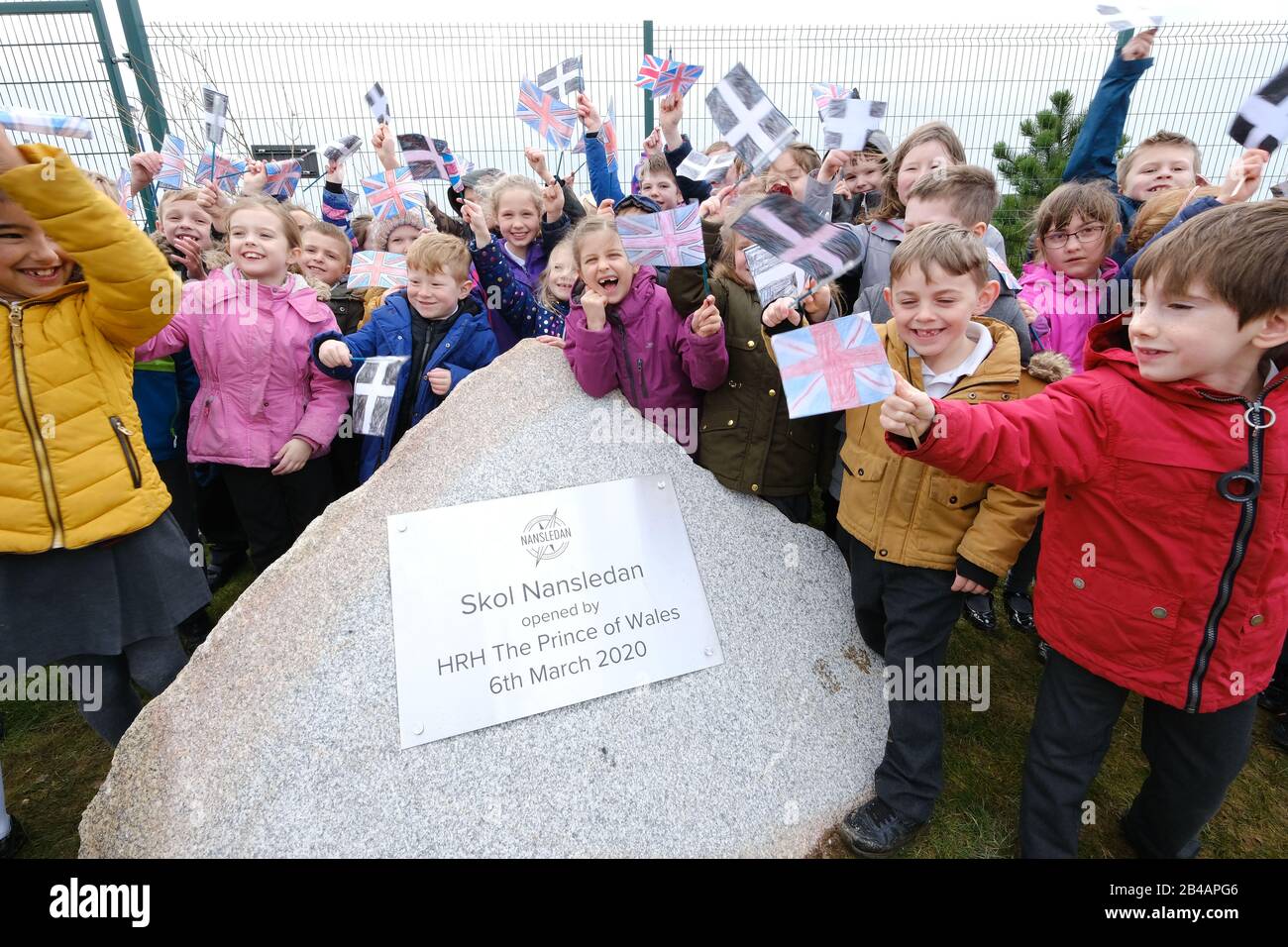 School children look on as a plaque is unveiled to officially open the ...