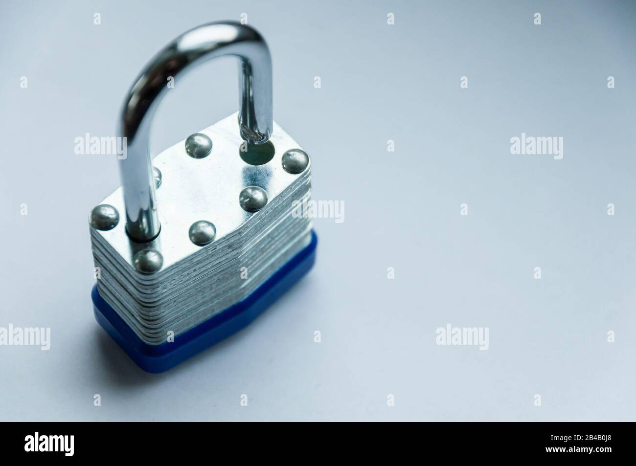 Silver padlock on a white background Stock Photo - Alamy