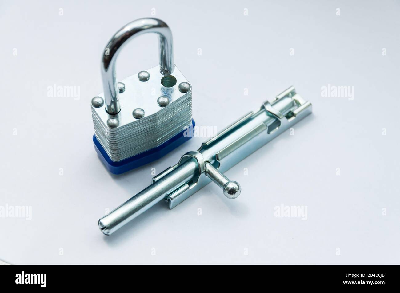 Silver padlock and latch on a white background Stock Photo - Alamy