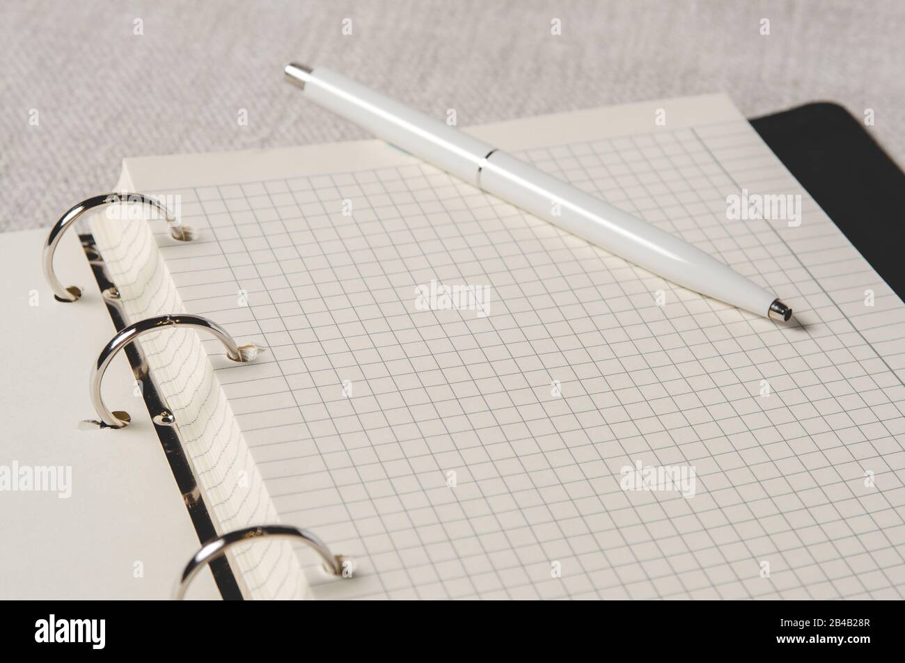 Close-up of a Notepad for writing and pen. Notebook with pages in a ...