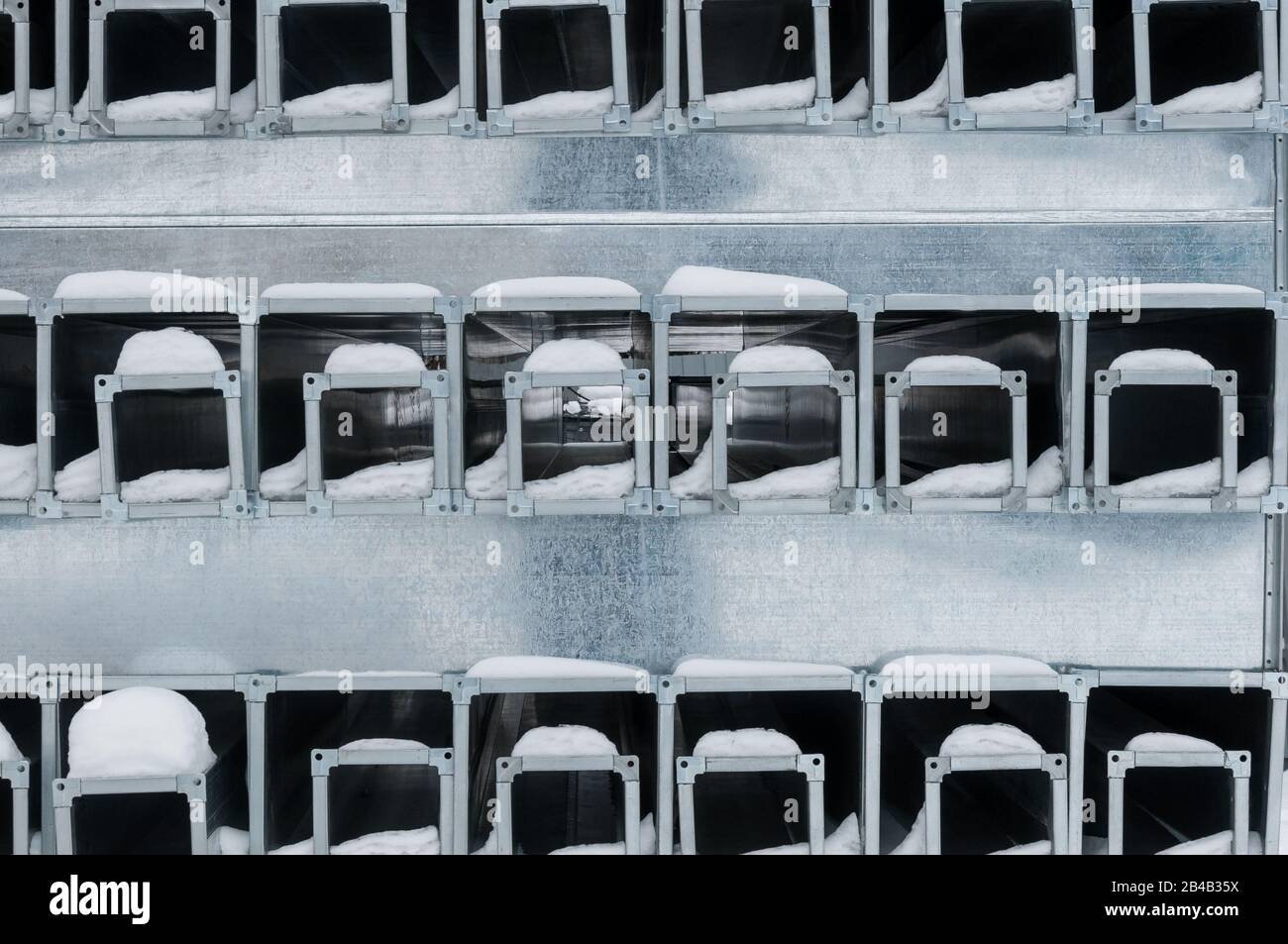 Ventilation ducts stacked for storage at a construction site Stock ...