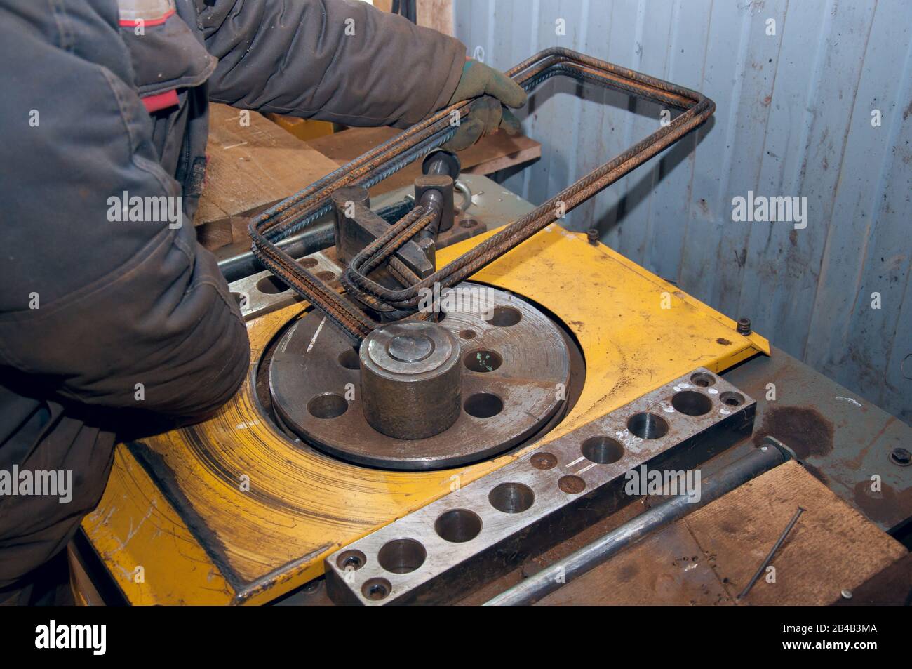 Equipment for bending steel rods at a construction site. Equipment for ...
