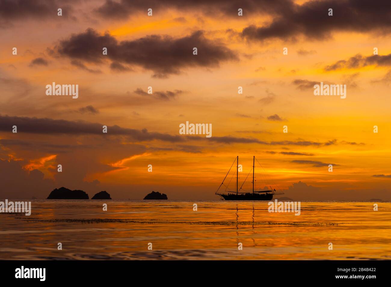 Colorful sunset on a tropical beach. Orange sunset on the ocean ...