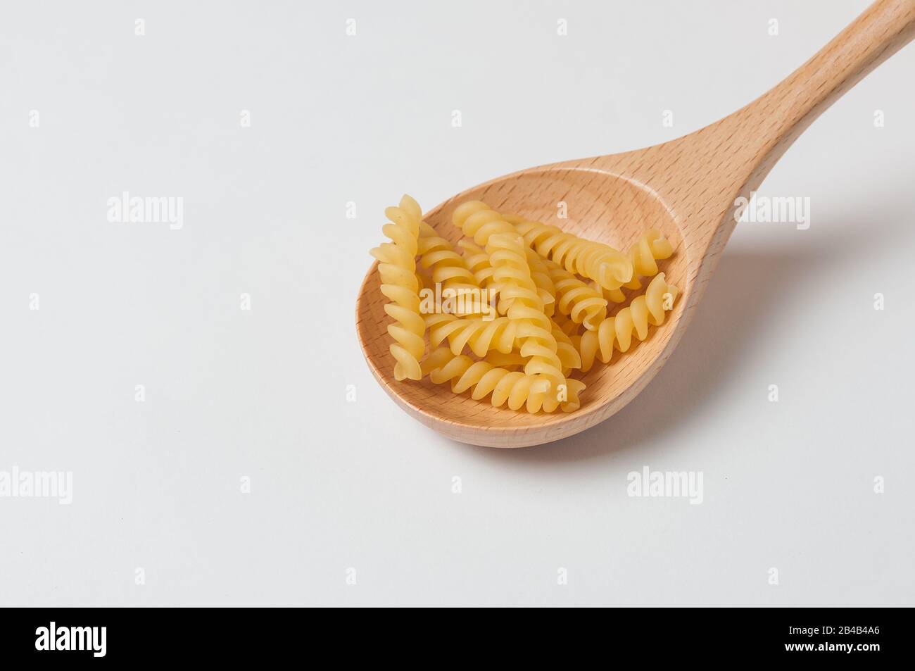 Italian food. One of the tipe of Italian pasta in a wooden spoon Stock ...