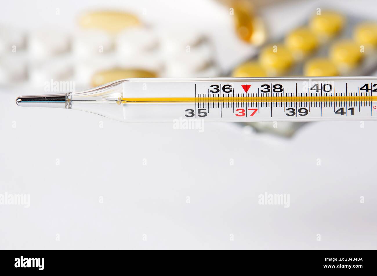 Thermometer and pills. A set of medicines on a white background Stock ...