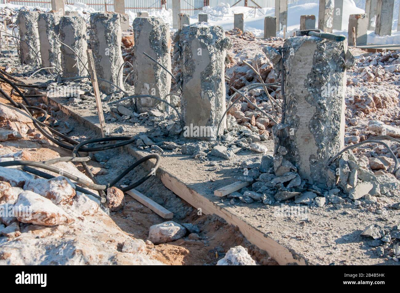 Demolition of concrete structures at the construction site. Preparing a ...