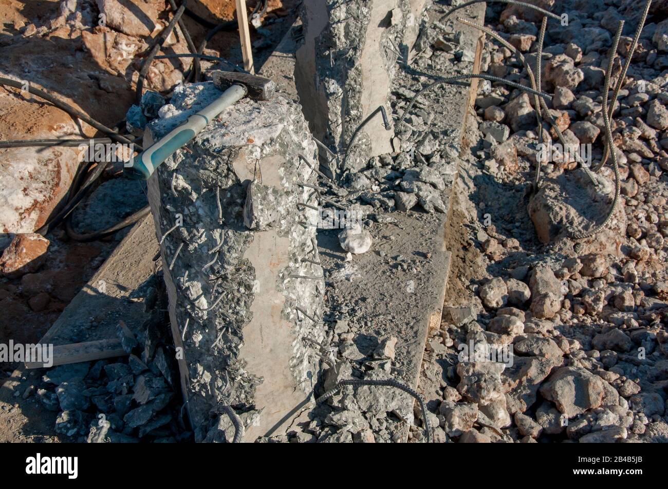 Demolition of concrete structures at the construction site. Preparing a ...