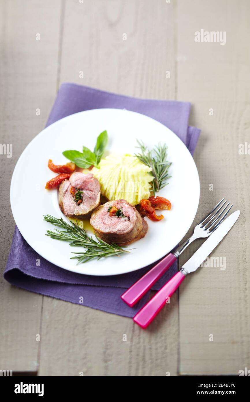 Lamb shoulder rolls rosemary Stock Photo - Alamy