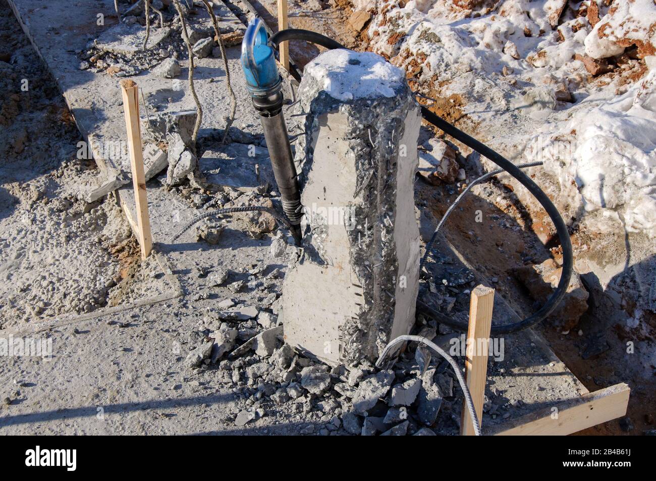 Demolition of concrete structures at the construction site. Preparing a ...